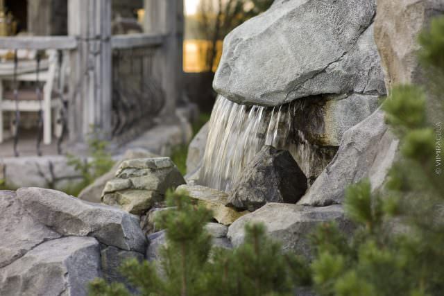 Garden pavilion and concrete waterfall