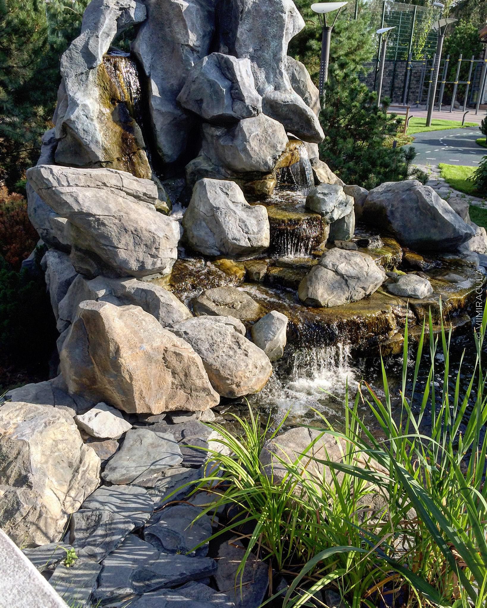 Garden pavilion and concrete waterfall