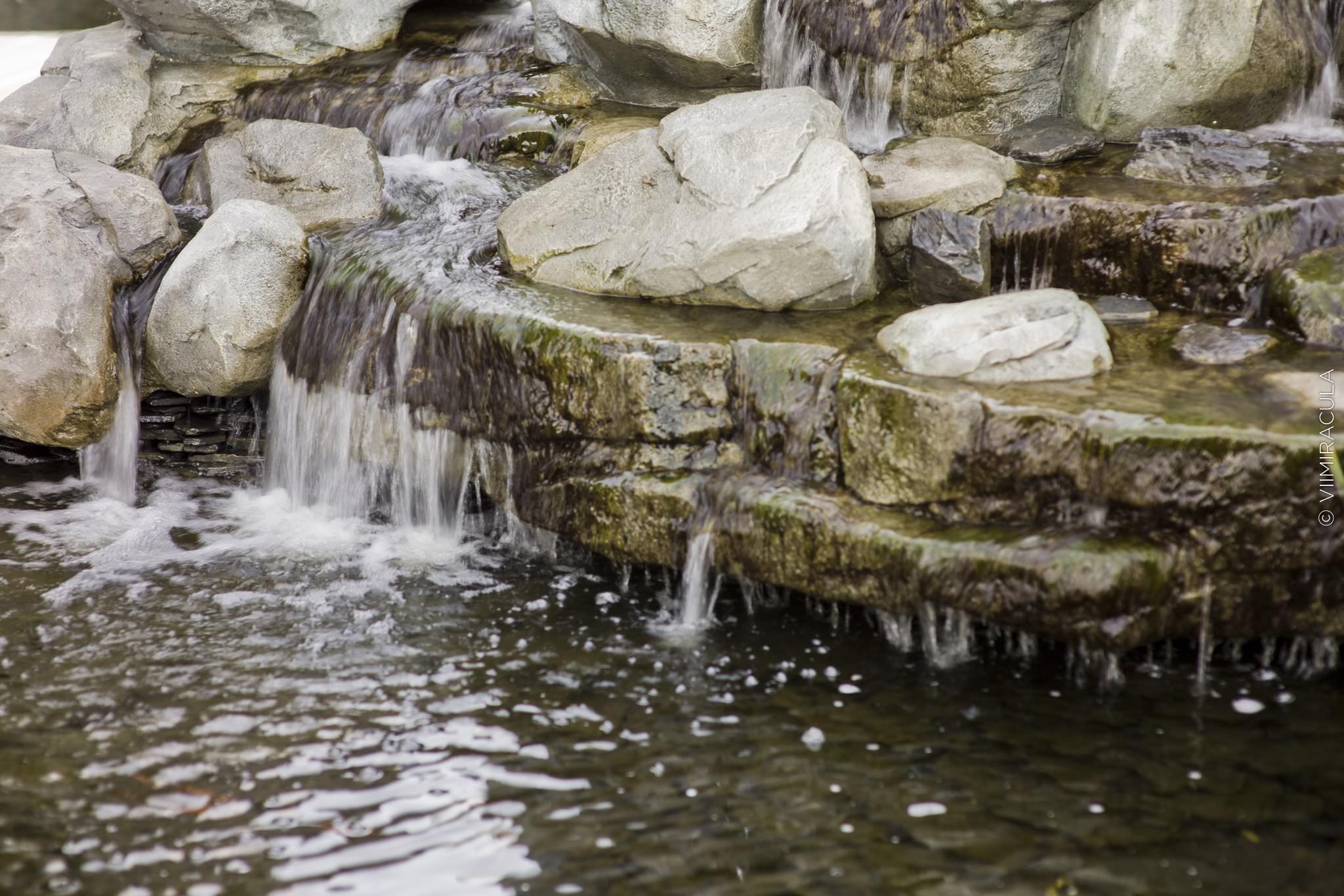 Garden pavilion and concrete waterfall